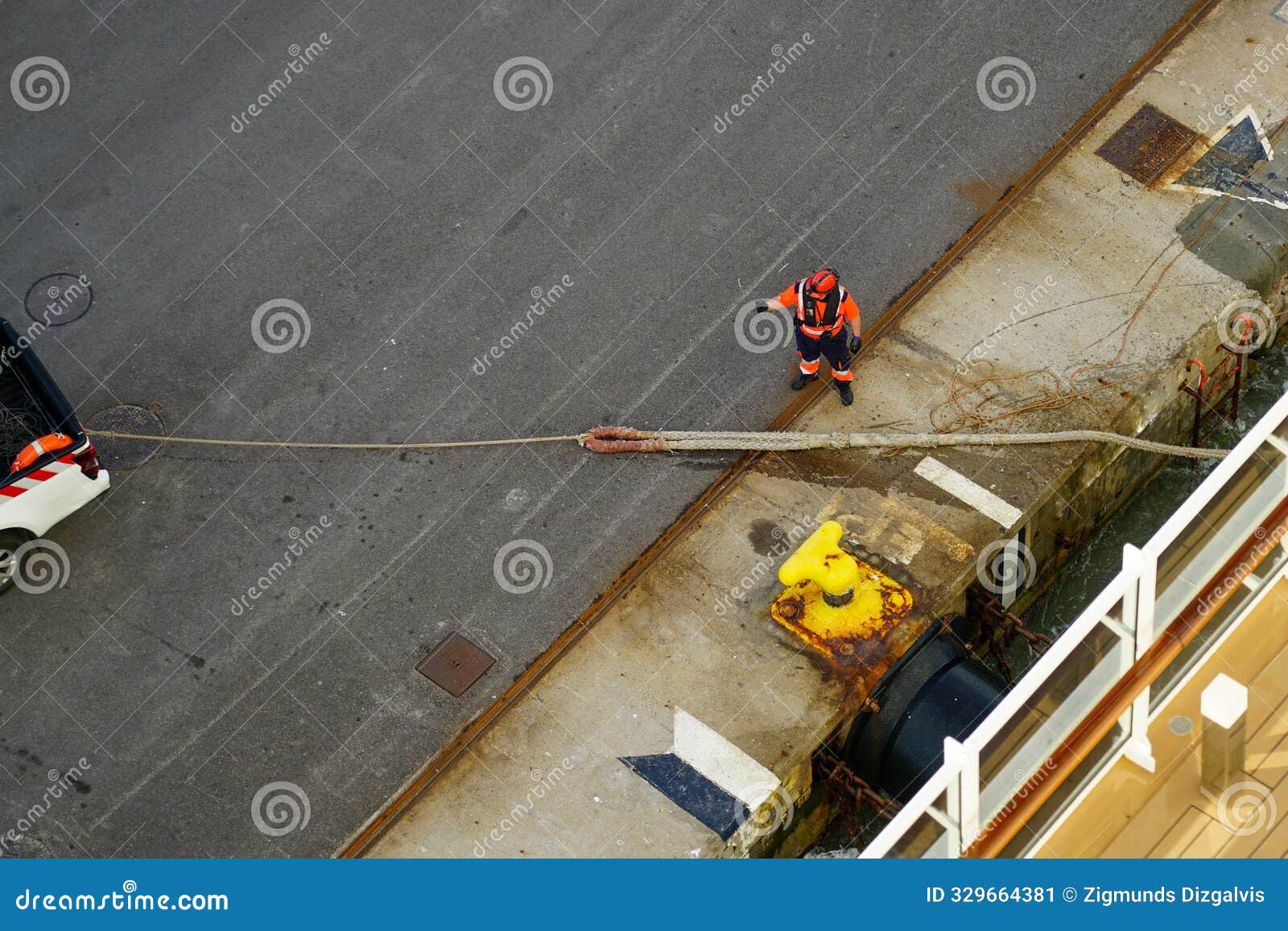 The Process of Mooring a Large Ship at the Harbor Pier, Pulling the ...