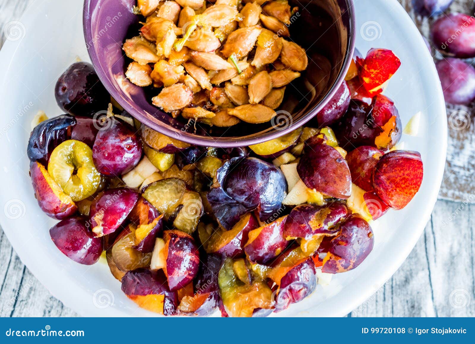 Pitting plums in process stock photo. Image of delicious - 99720108