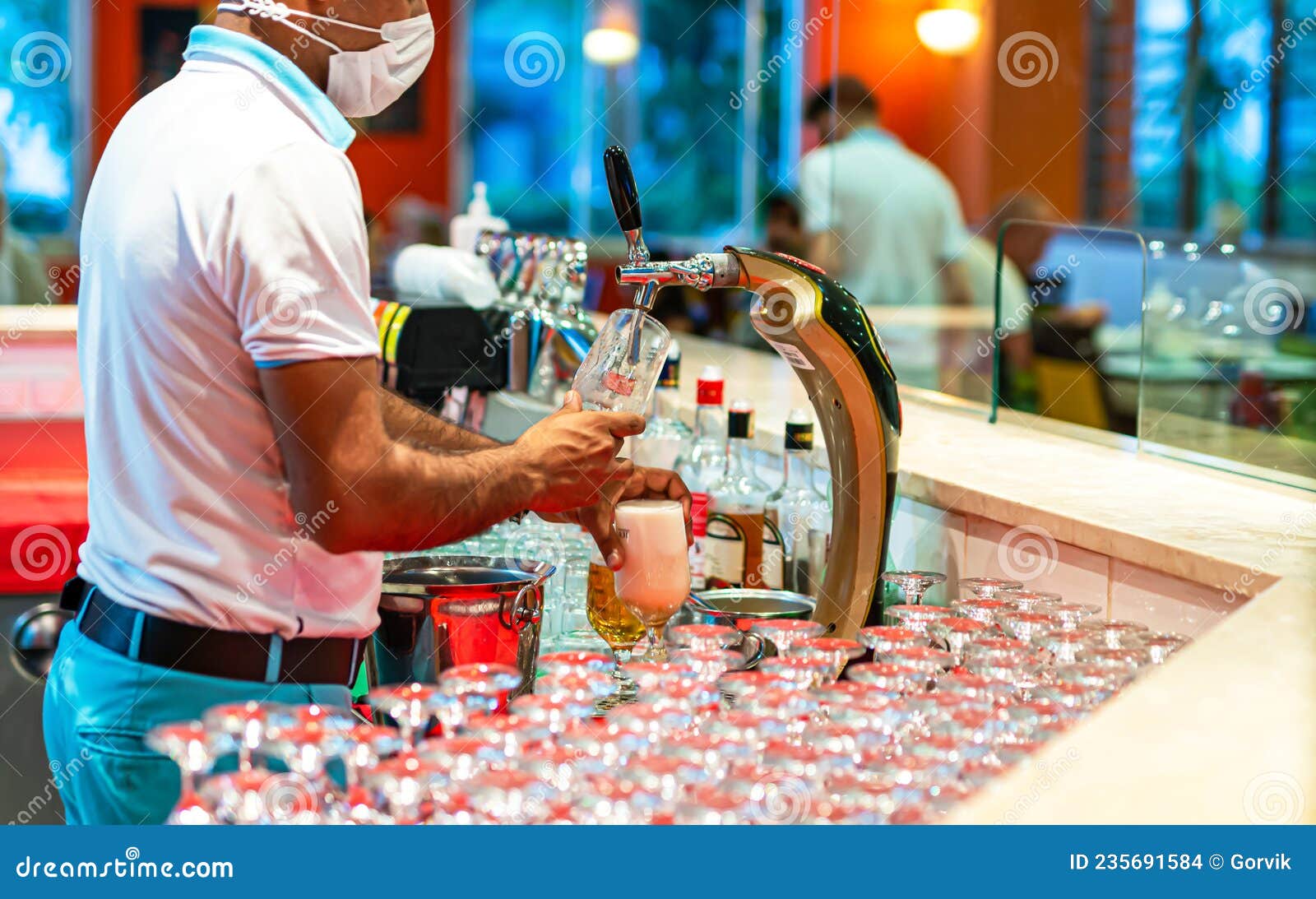 The Process of Pouring Beer into a Glass in a Bar Stock Photo - Image ...