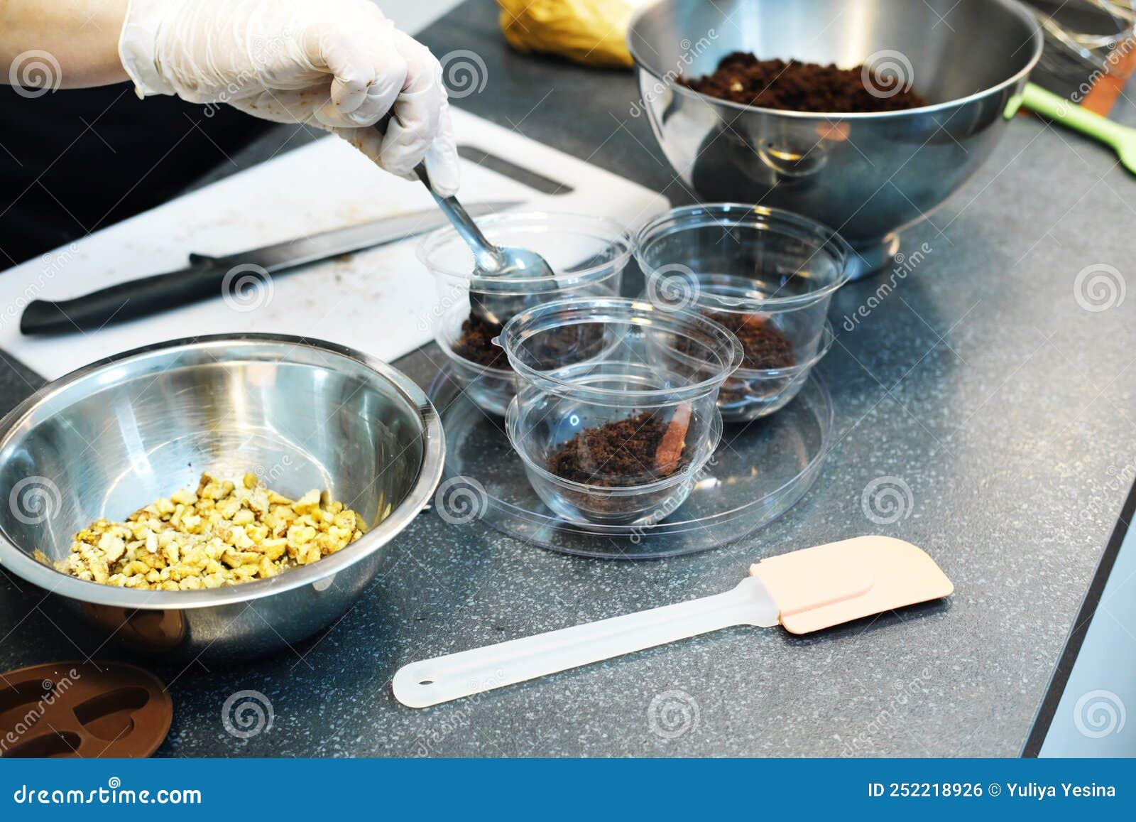 The Process of Preparing a Multi-layered Dessert.the Confectioner Puts ...