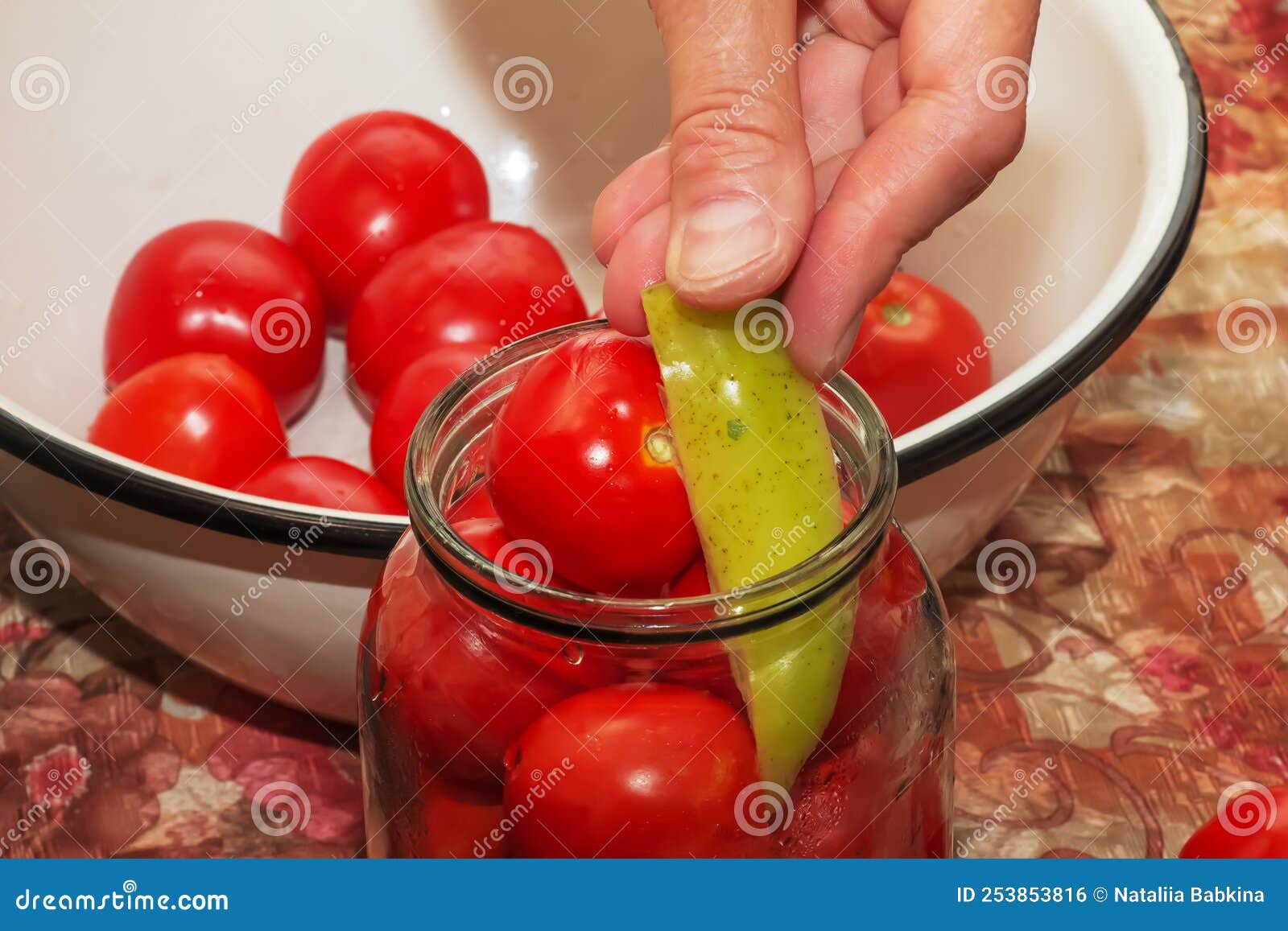 The Process of Preserving Tomatoes for the Winter. Female Hands Stack Ripe Red Juicy Tomatoes in ...
