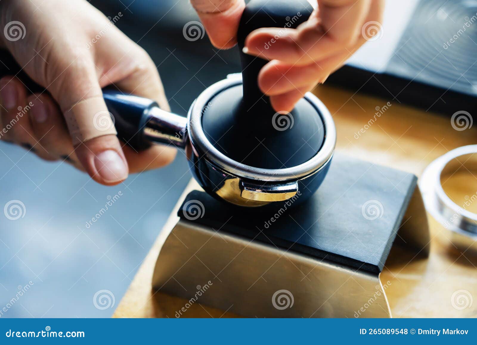 The Process of Pressing Ground Coffee with Tamper. Preparing a Drink in ...