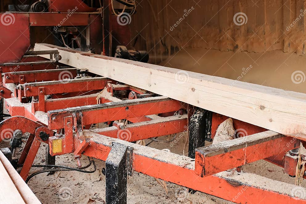 The Process of Processing Wood at a Sawmill. Timber Industry Stock ...