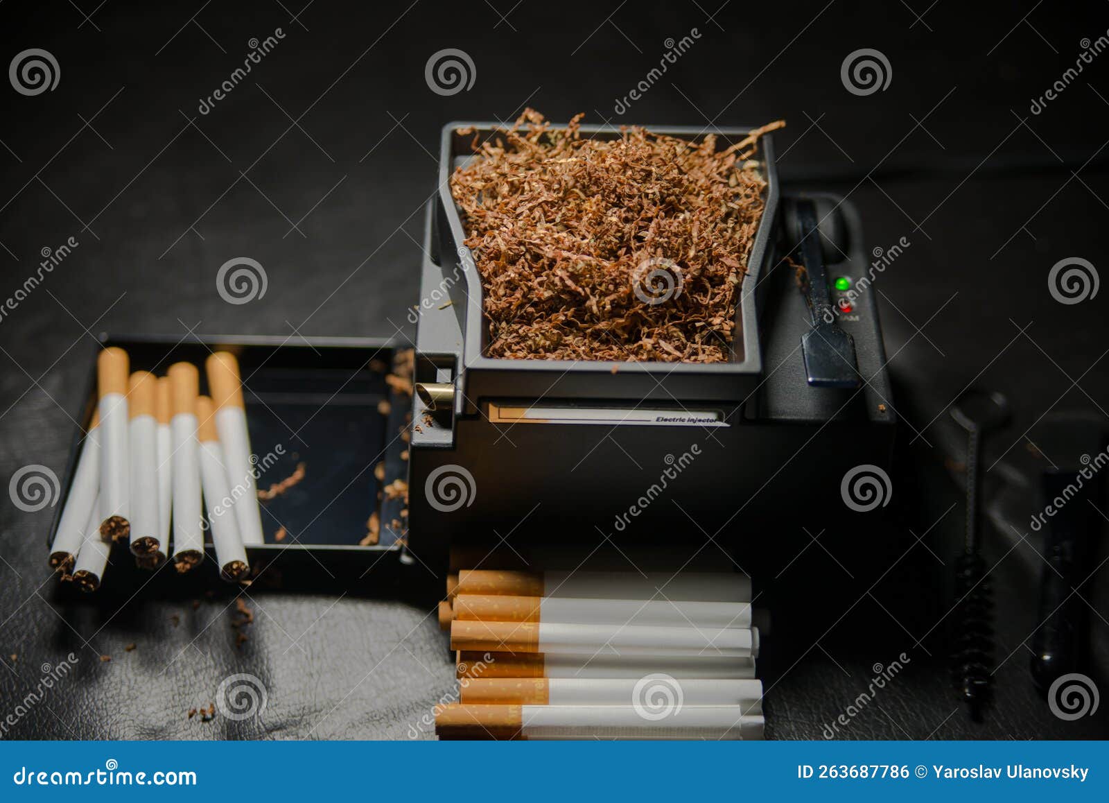 The Process of Putting Tobacco into Cigarette Cases with a Semi ...