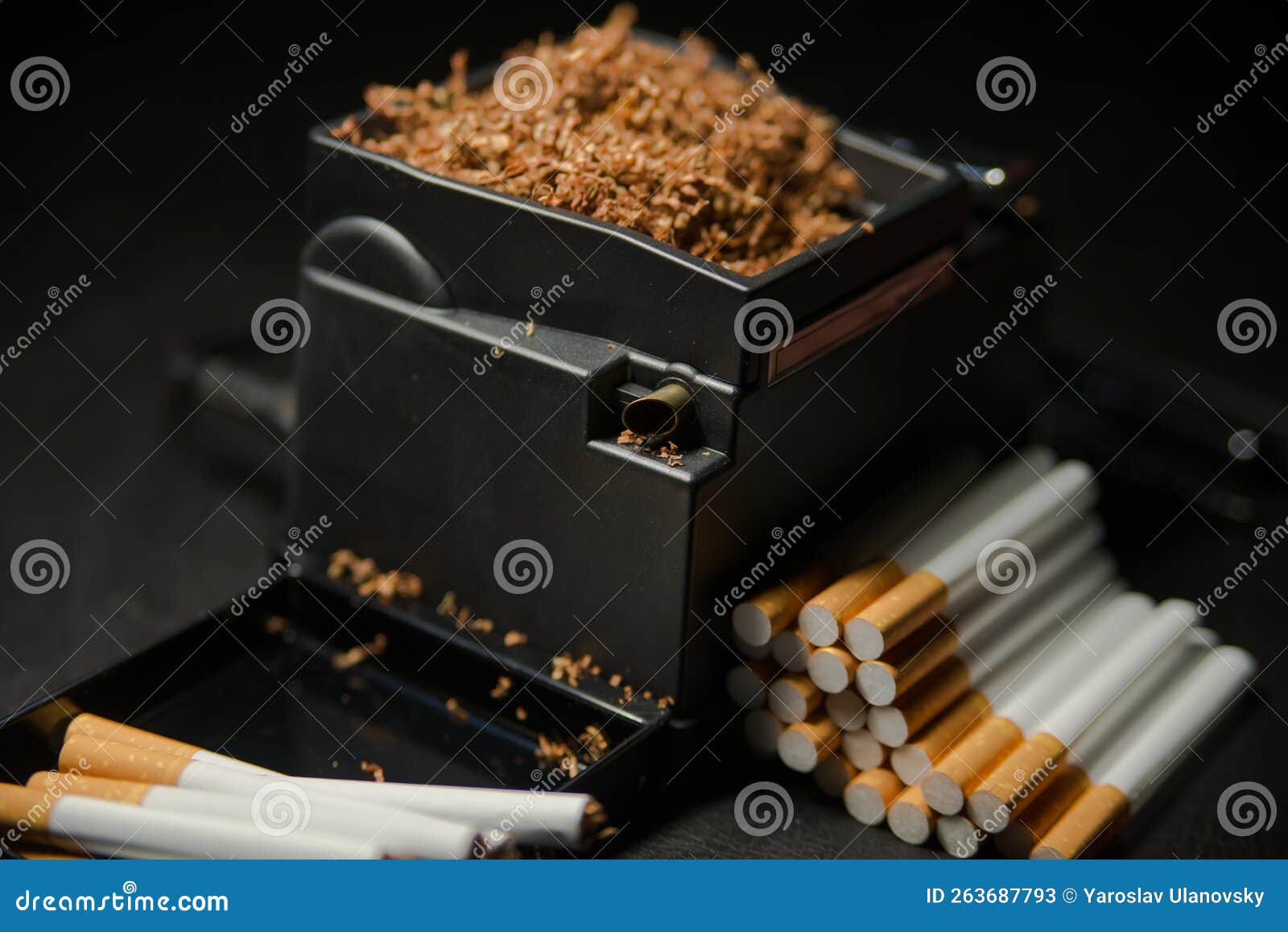 The Process of Putting Tobacco into Cigarette Cases with a Semi ...