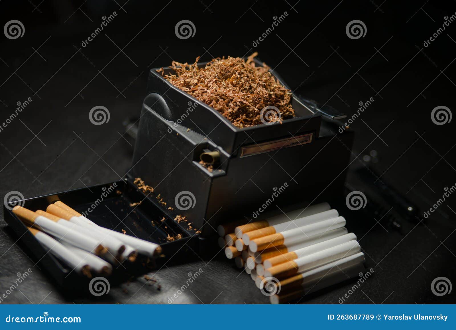 The Process of Putting Tobacco into Cigarette Cases with a Semi ...
