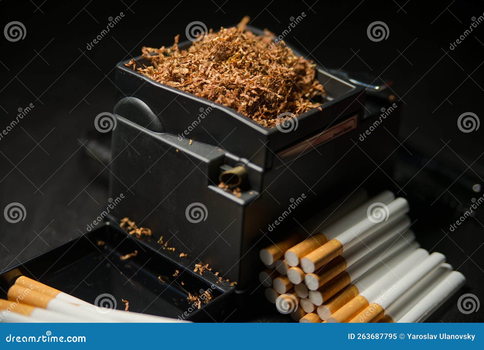 The Process of Putting Tobacco into Cigarette Cases with a Semi ...