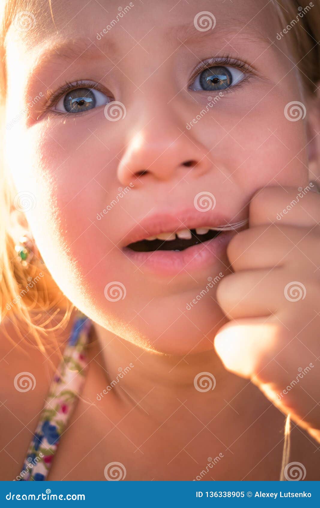 The Process of Removing a Baby Tooth Using a Thread Stock Image - Image ...