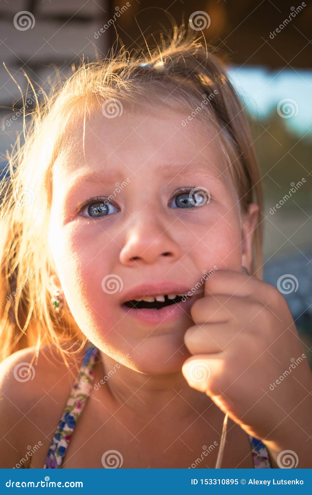 The Process of Removing a Baby Tooth Using a Thread Stock Image - Image ...