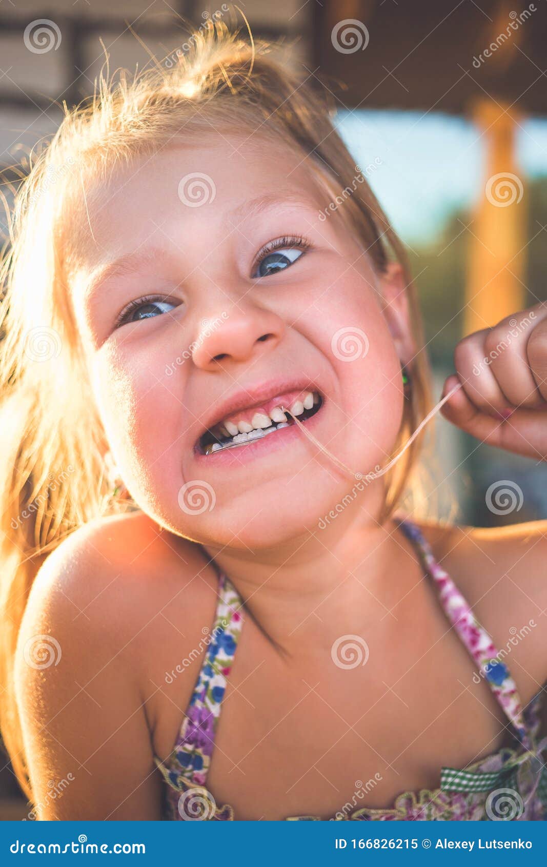 The Process of Removing a Baby Tooth Using a Thread Stock Image - Image ...