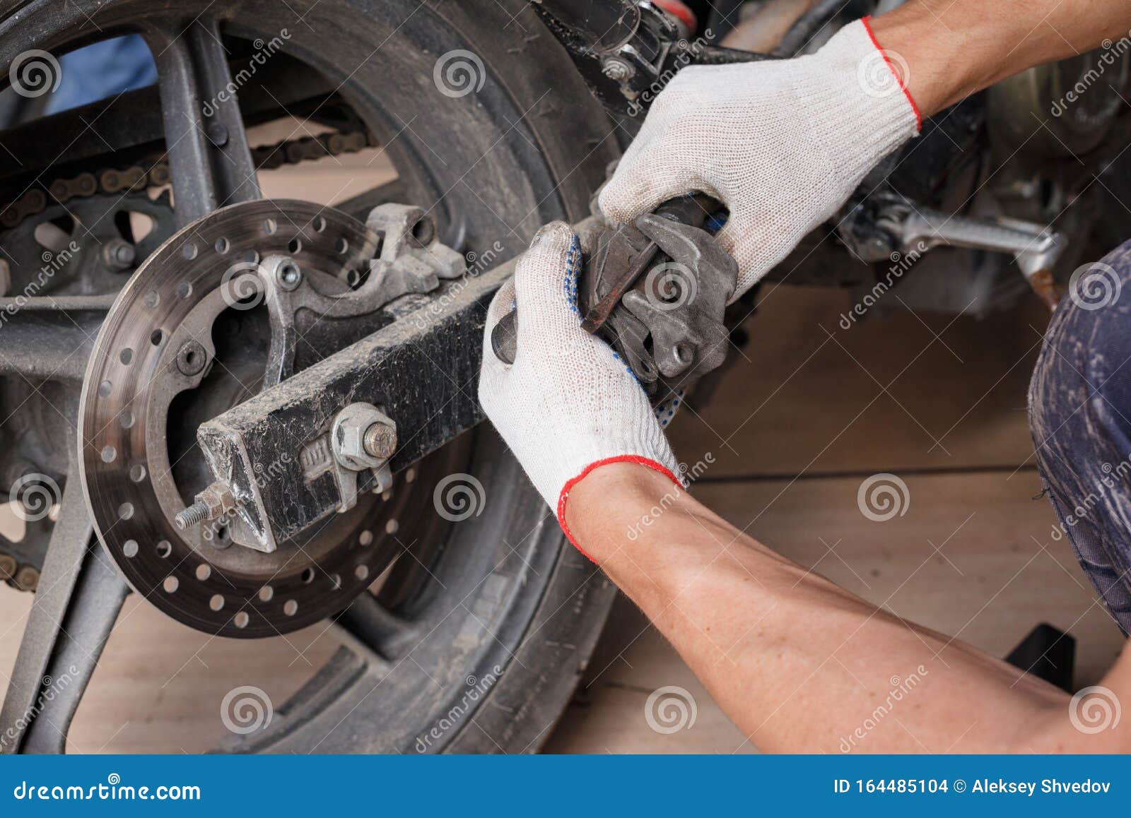 The Process of Replacing Brake Pads on a Motorcycle Stock Photo - Image ...