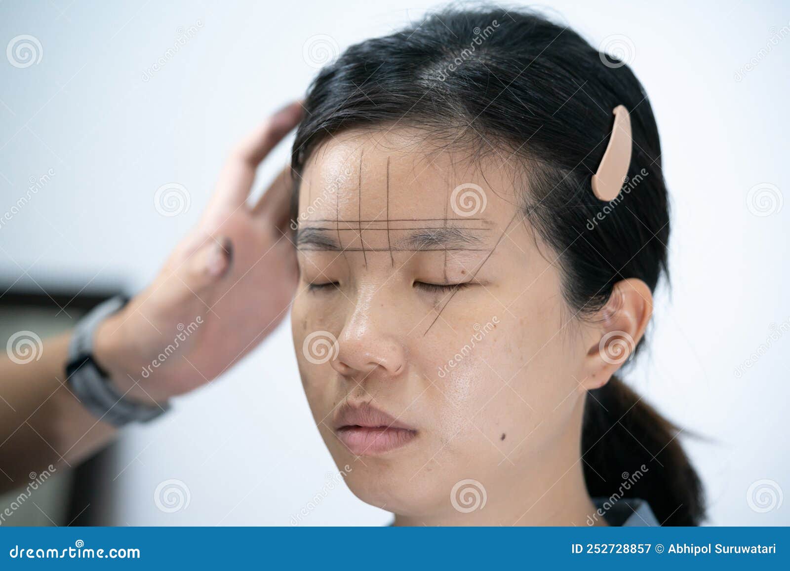 The Process of Shaping Eyebrows by a Beauty Master with a Thread for a ...