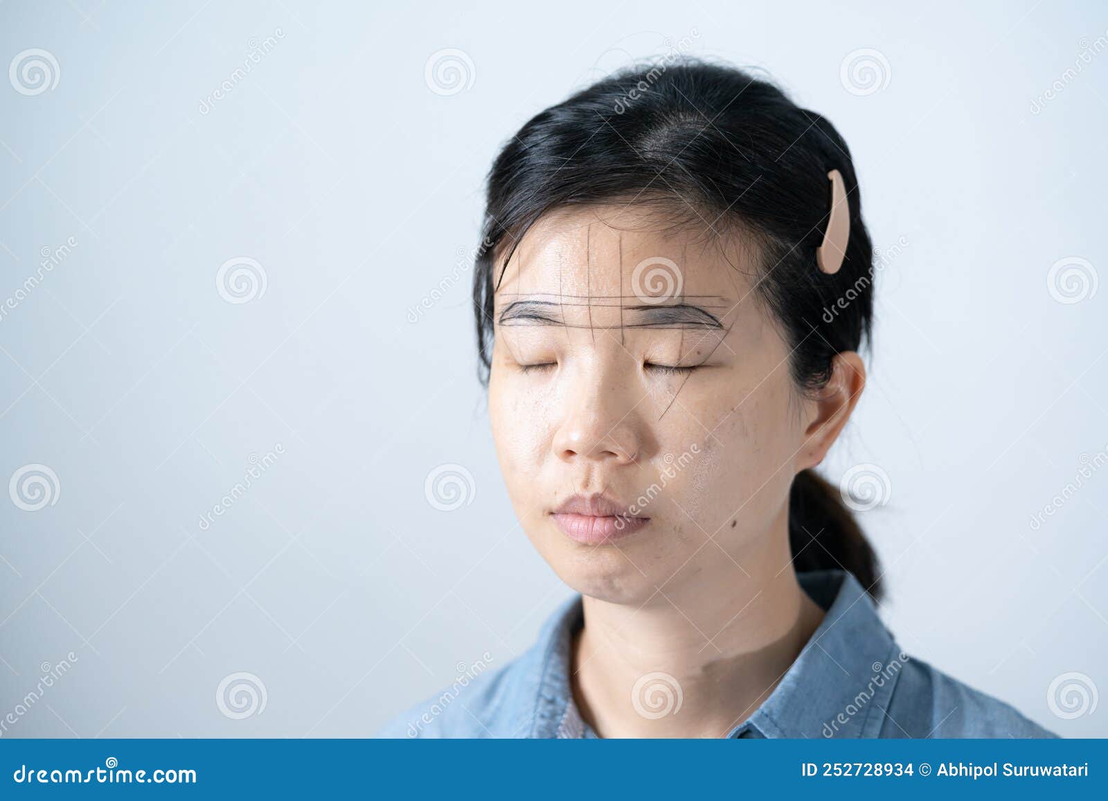 The Process of Shaping Eyebrows by a Beauty Master with a Thread for a ...