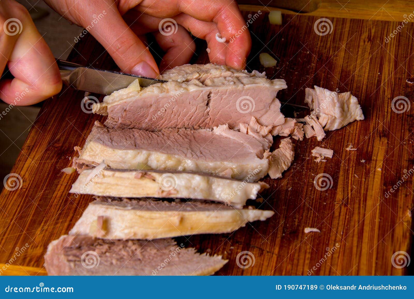 Sliced cooked meat stock image. Image of appetizer, hand - 190747189