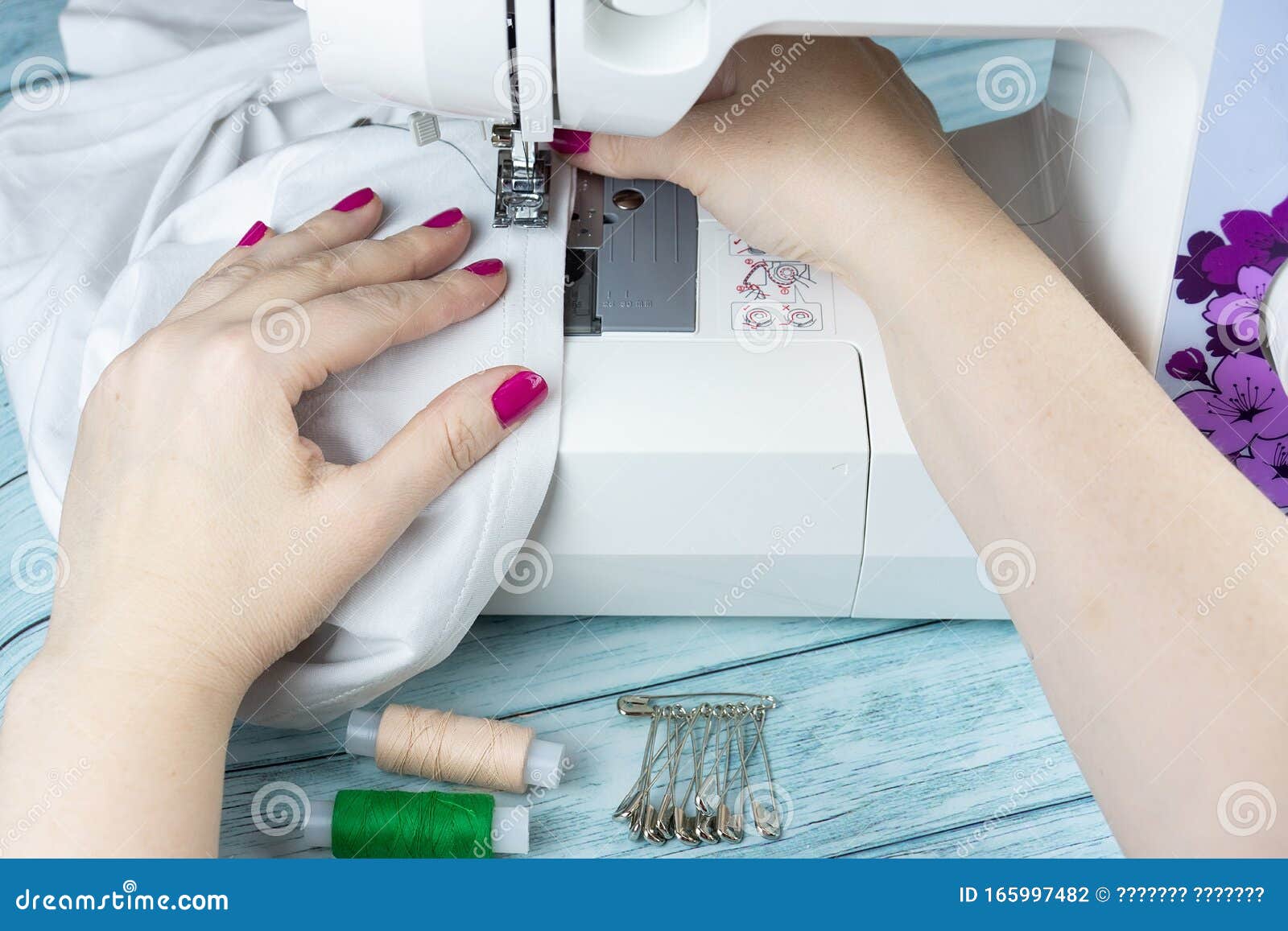 Hands on the Sewing Machine Stock Photo - Image of electric, clothes ...