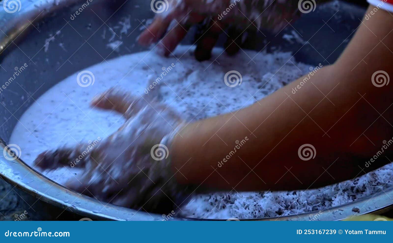 The Process of Taking Coconut Milk from Grated Coconut Manually. Stock ...