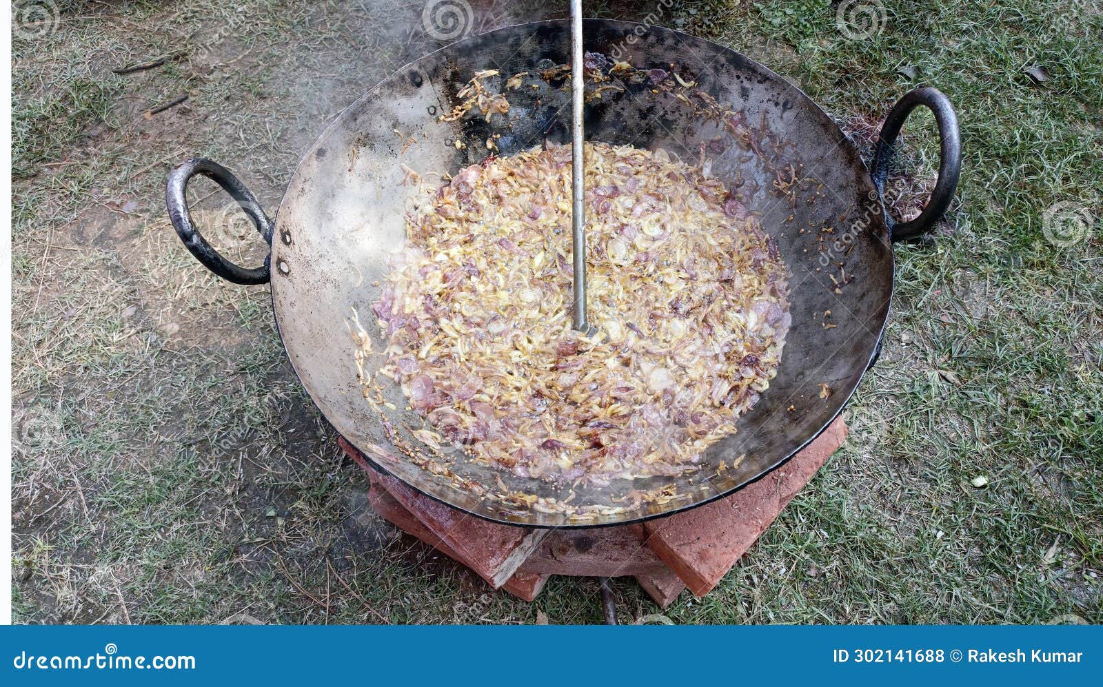 Process of Tempering an Indian Vegitable in Huge Steel Pan India Stock ...