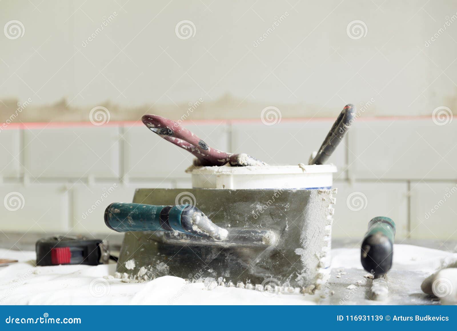 Process of Tiling the Tiles in the Kitchen with Necessary Tiling Stock ...