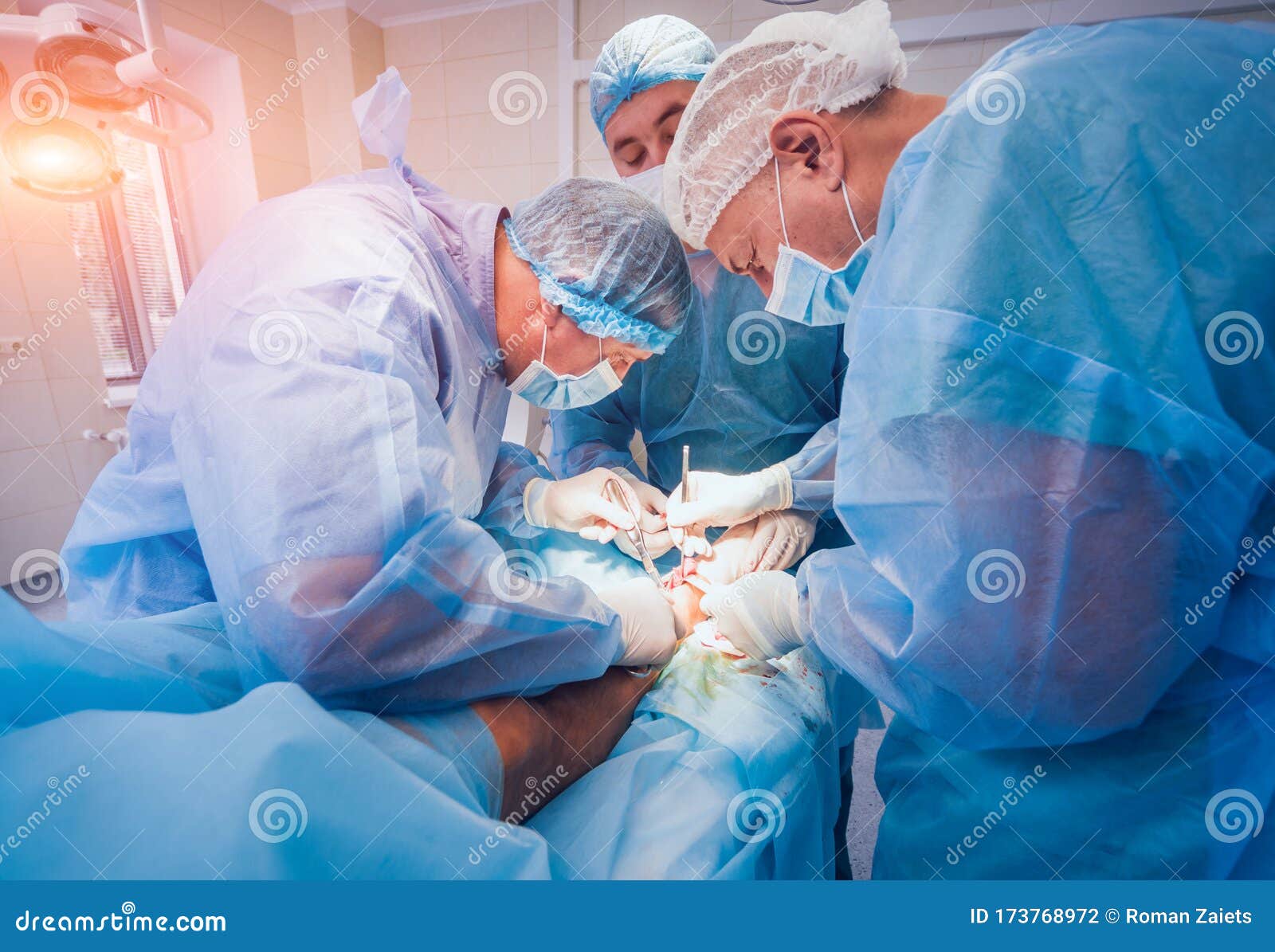 Process of Trauma Surgery Operation. Group of Surgeons in Operating ...