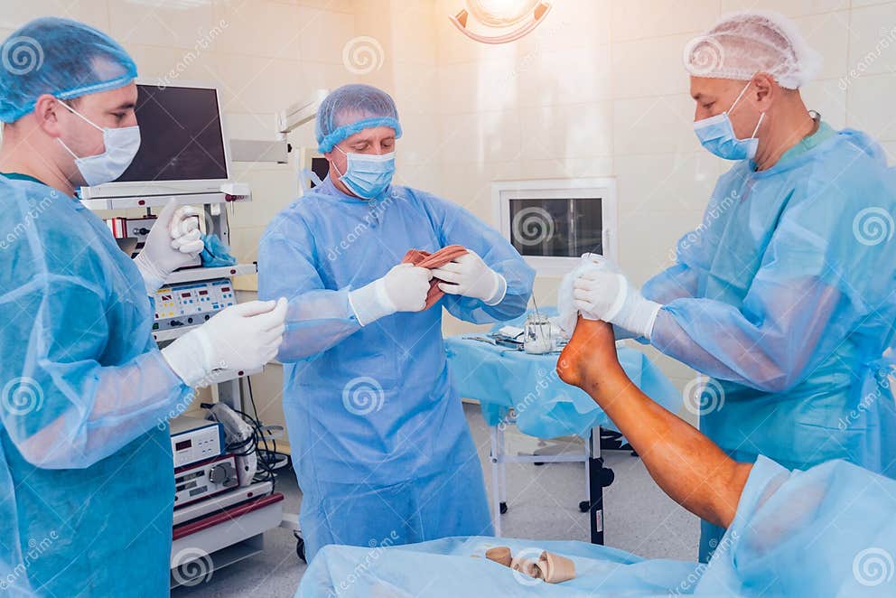 Process of Trauma Surgery Operation. Group of Surgeons in Operating ...