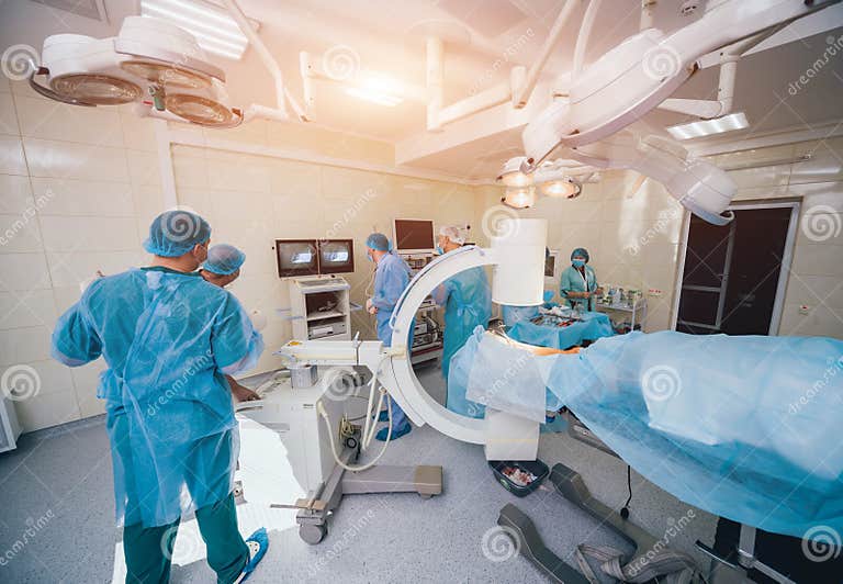 Process of Trauma Surgery Operation. Group of Surgeons in Operating ...