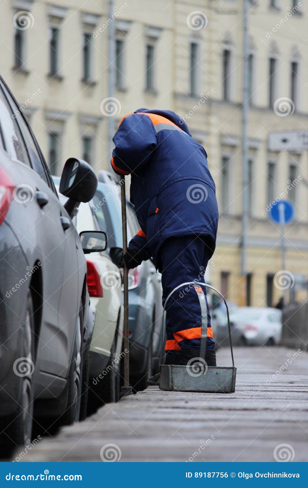 Process of Urban Street Cleaning Sweeping. Worker with Broom and Dust ...