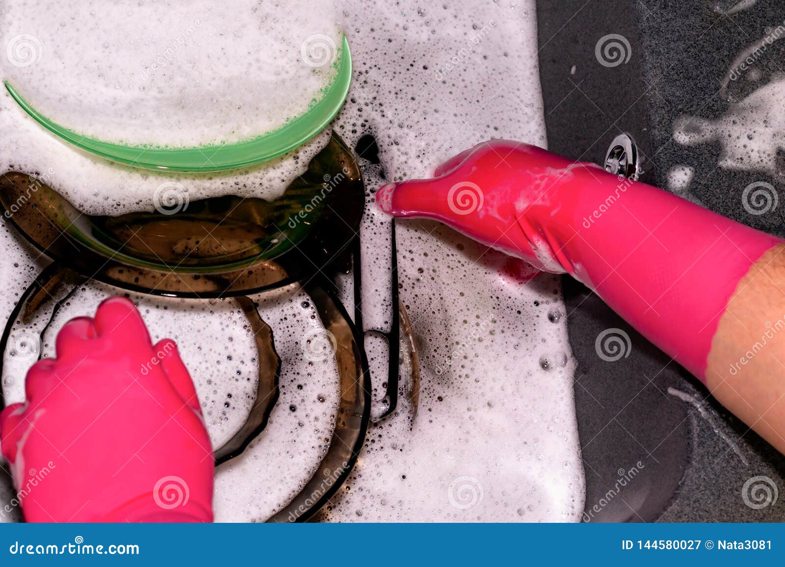The Process of Washing Plates in the Sink, Hands and Plates Closeup ...
