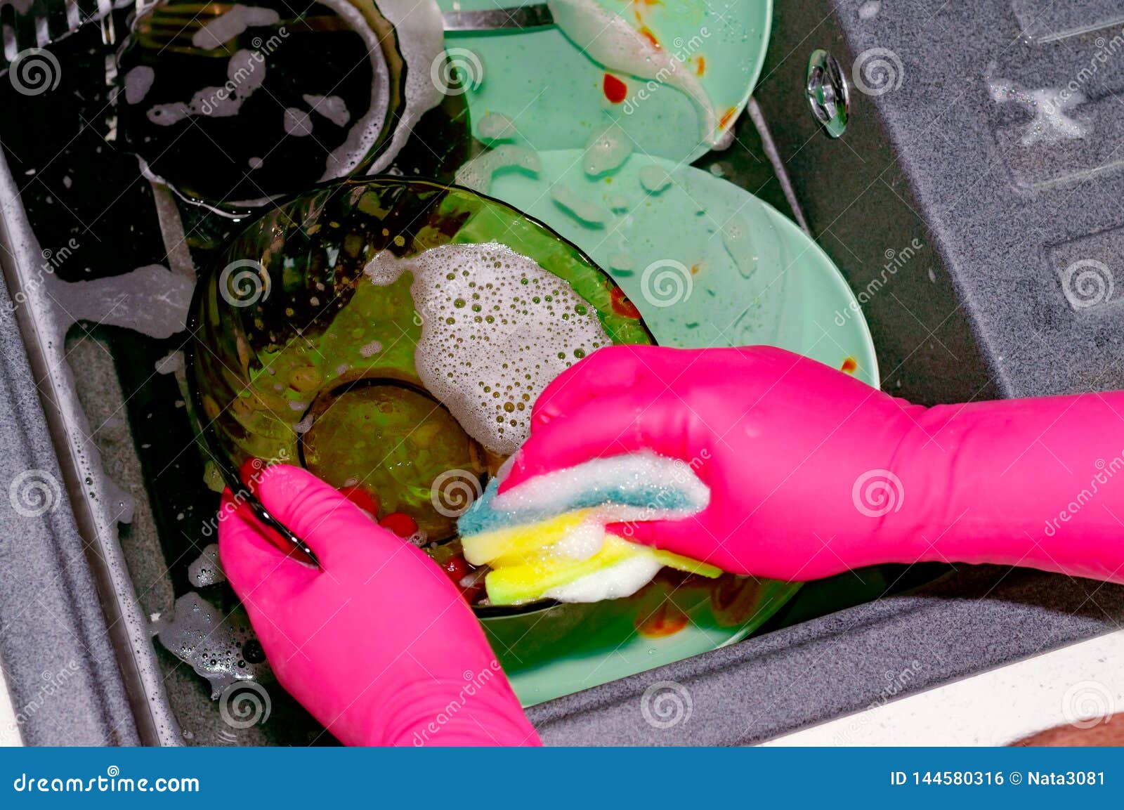 The Process of Washing Plates in the Sink, Hands and Plates Closeup ...