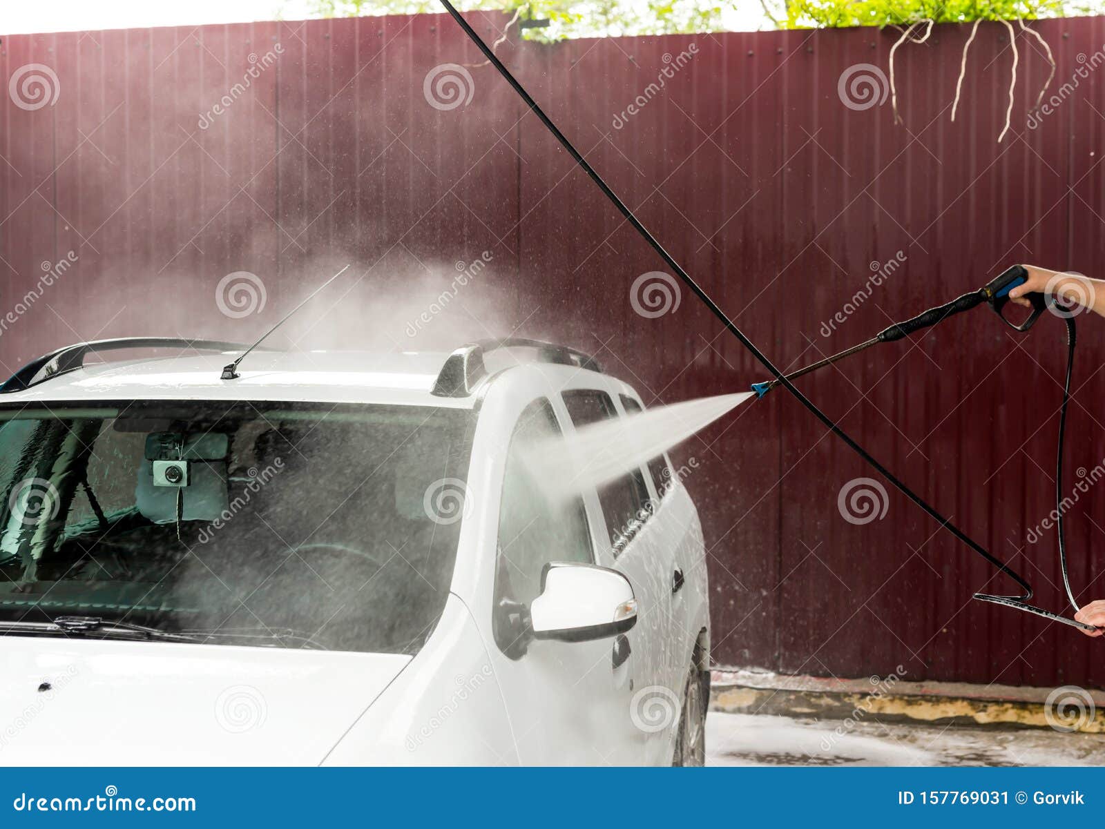 The Process of Washing a White Car Using a Pressure Washer Stock Image ...
