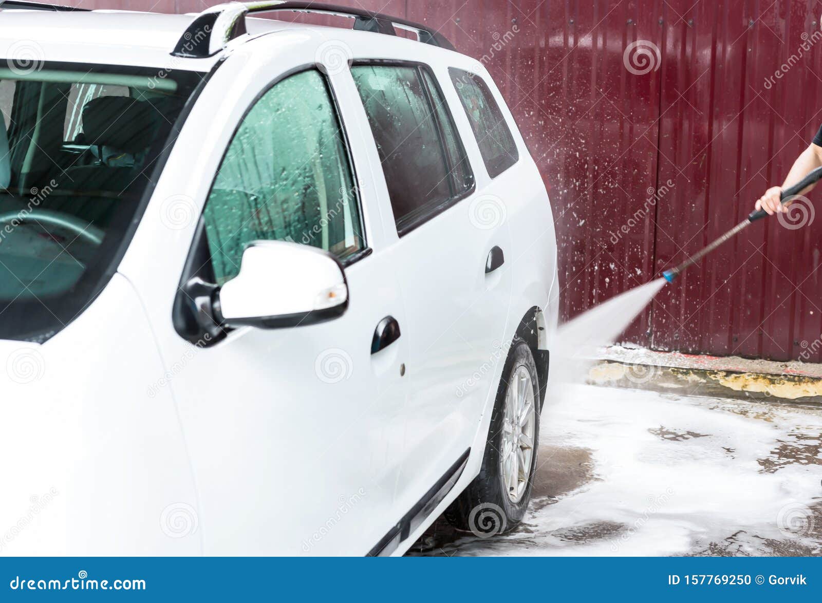 The Process of Washing a White Car Using a Pressure Washer Stock Photo ...