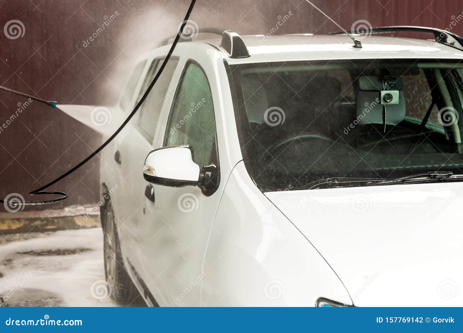 The Process of Washing a White Car Using a Pressure Washer Stock Photo ...