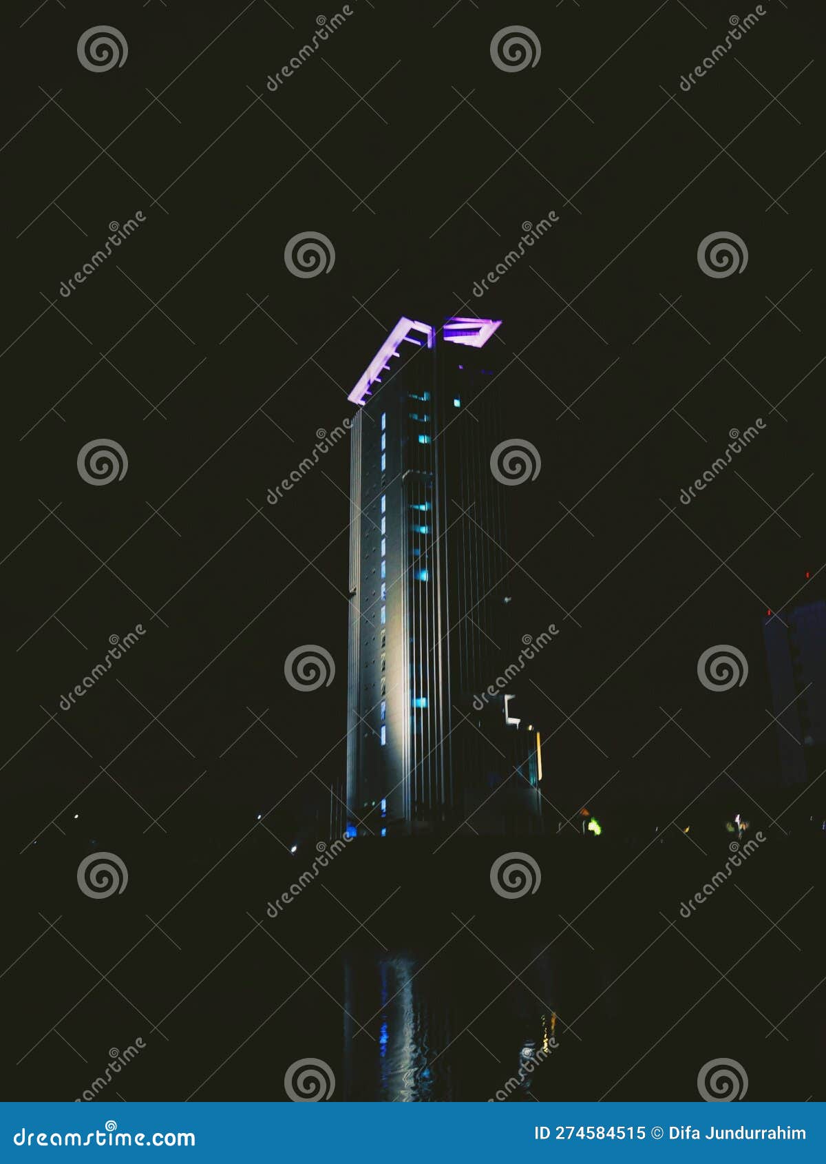 Skyscraper Building with Lake View Shining at Night Time Stock Image ...