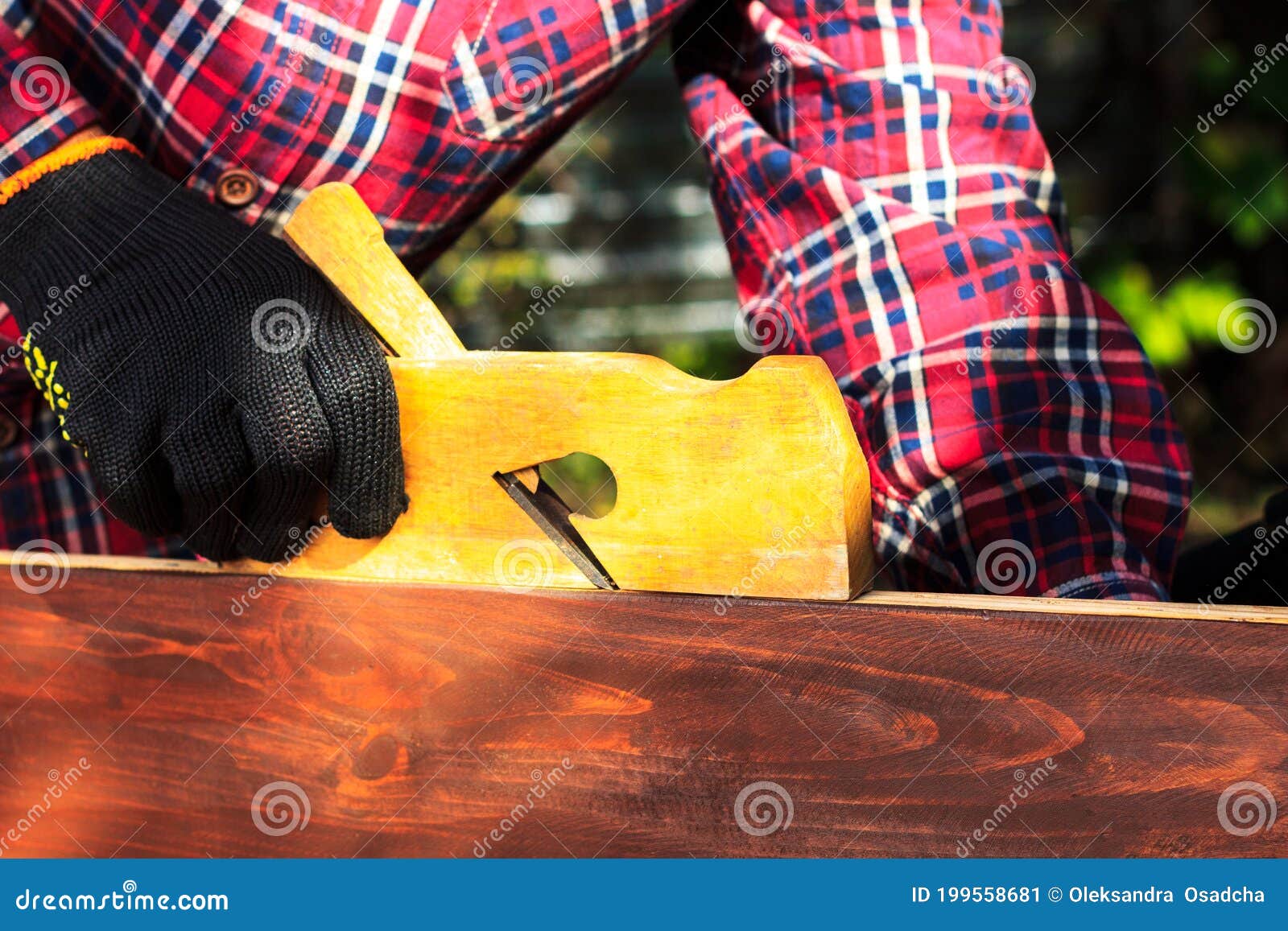 Processing the End of the Board with a Plane. Carpentry Workshop. Hobby ...