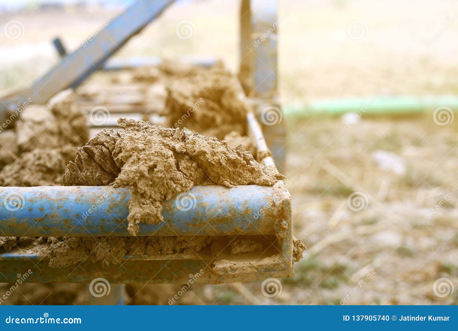 Processing Seeds through Mud and Machine Stock Photo - Image of ...