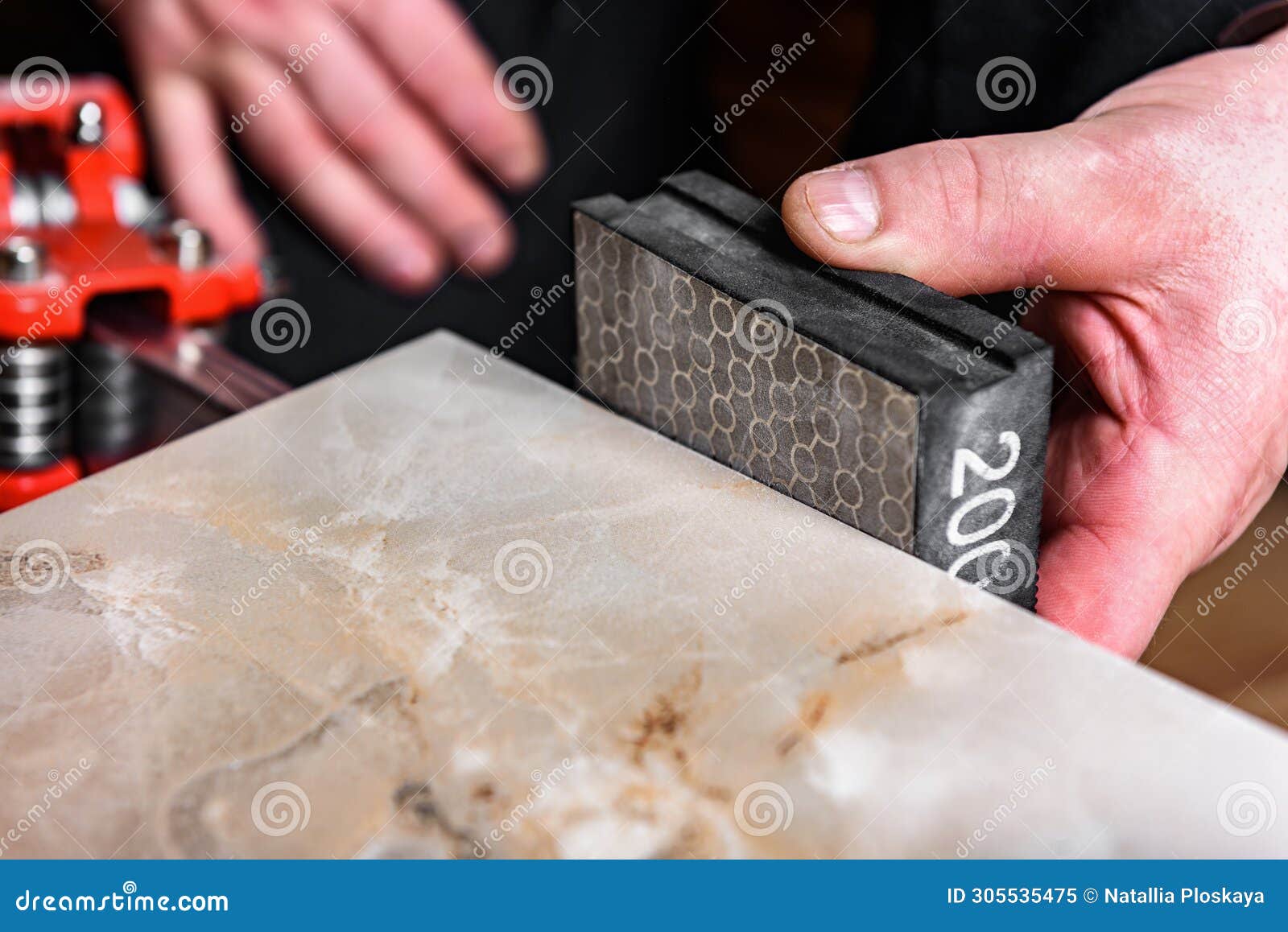 Processing of Tile Edges with Diamond Grinding Sponge. Stock Image ...