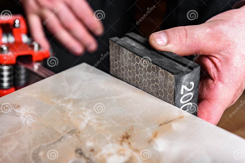 Processing of Tile Edges with Diamond Grinding Sponge. Stock Image ...