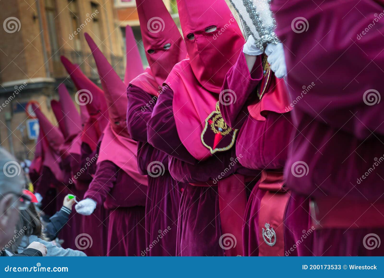 Procession of Catholic Devotees in Maroon Capirotes during the Holy ...