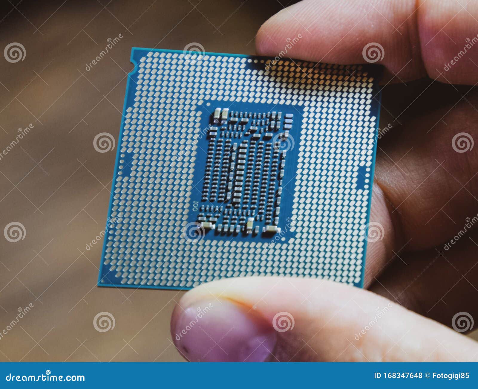 The is a Desktop Computer in Hand. Inspect the CPU Contacts before ...