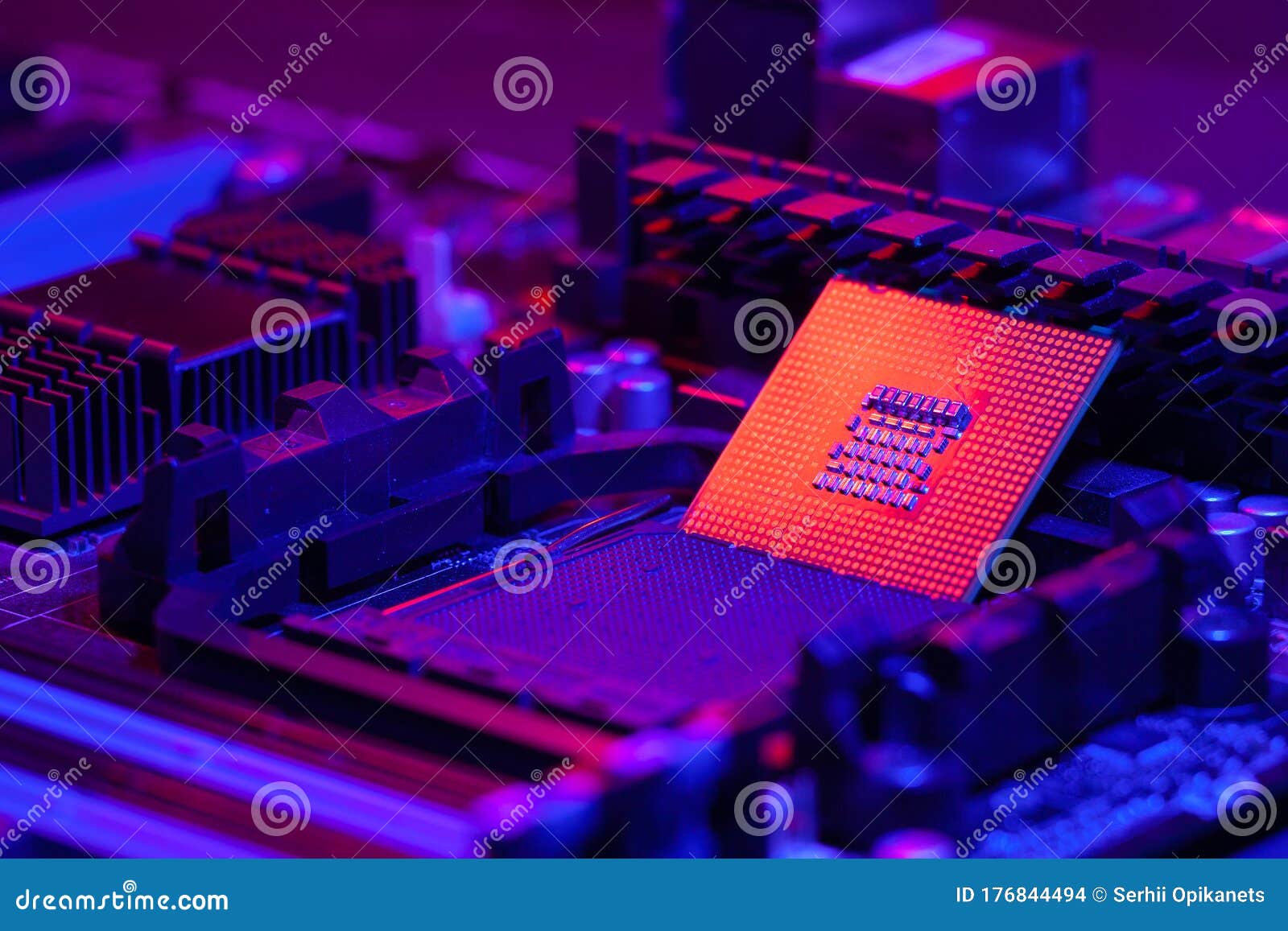 The Processor on the Motherboard in Neon Light. Computer Parts Stock ...