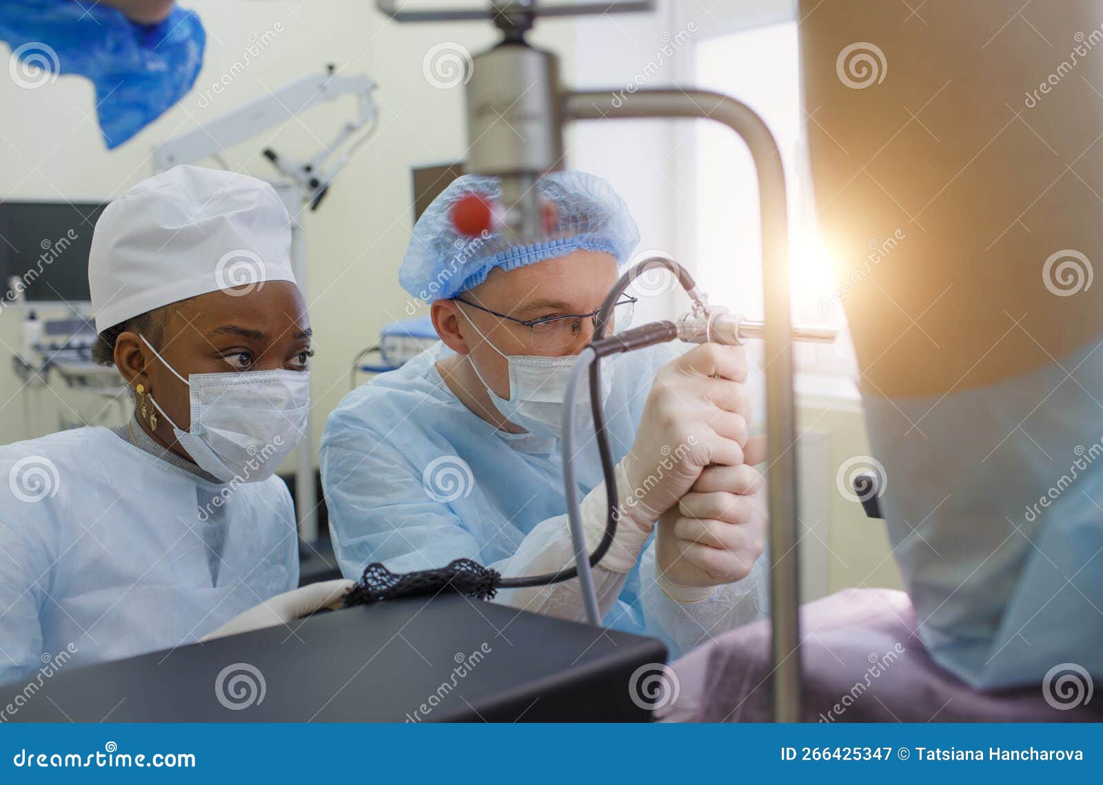 A Proctologist with an Assistant Performs an Operation on a Patient ...