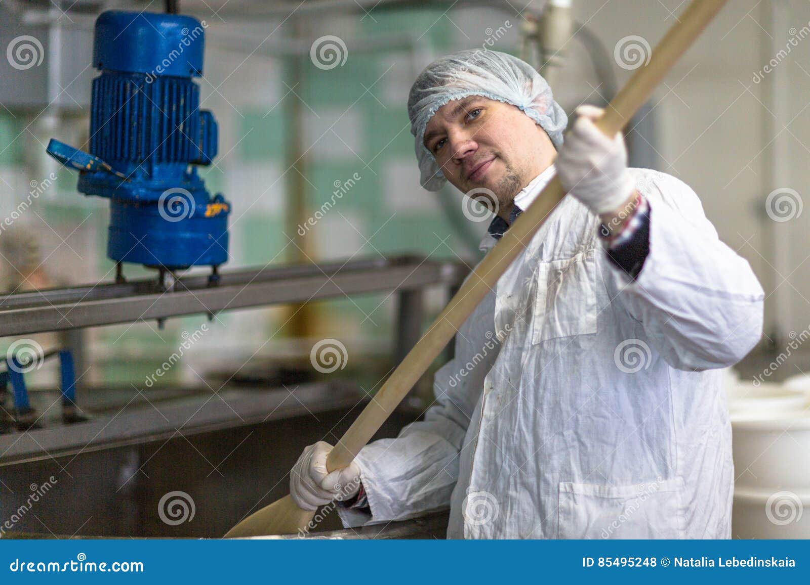 Production of Cheese in Dairy, Worker Cheese Mixes Stock Photo - Image ...