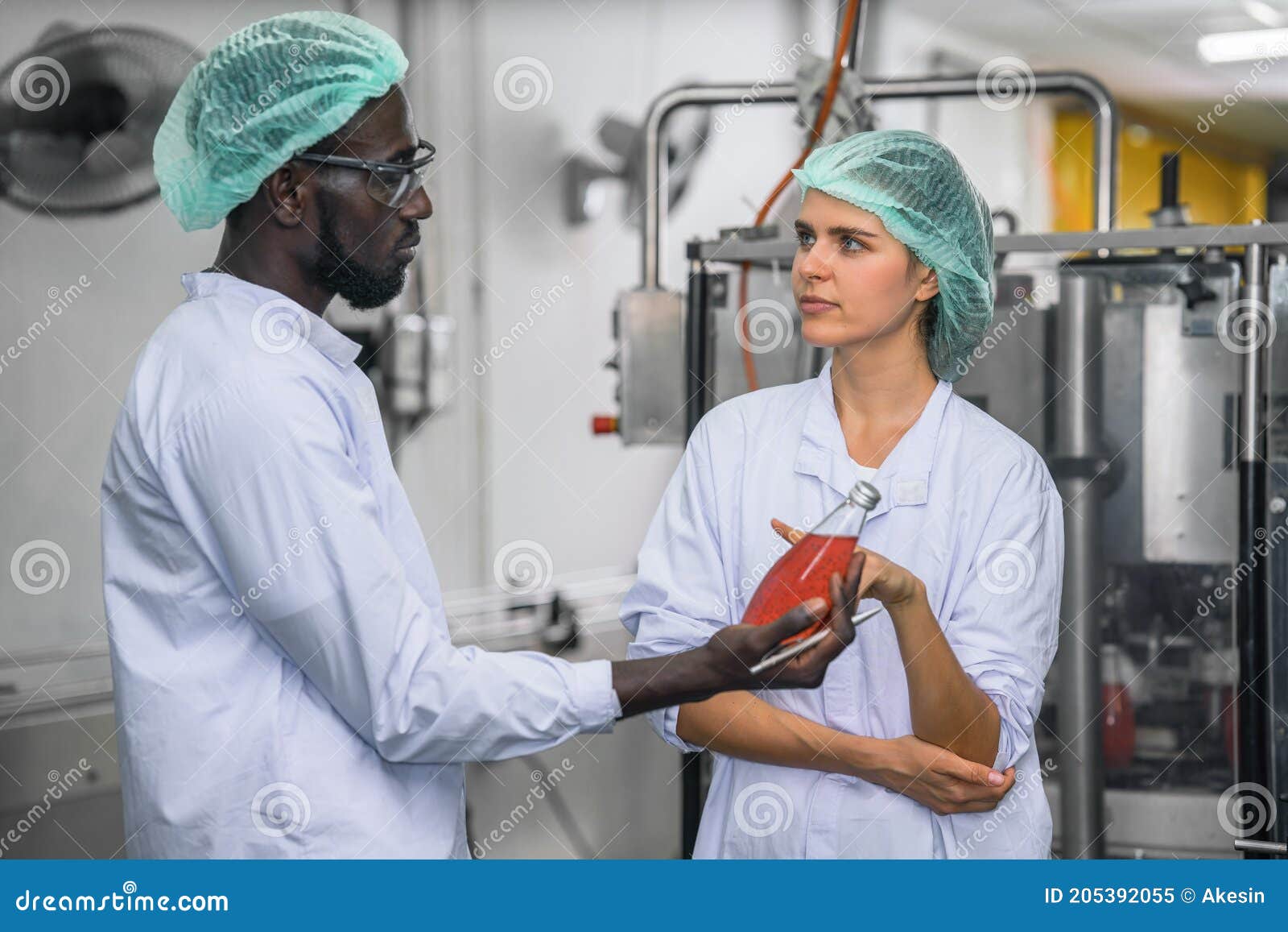 Production Line Supervisor and Worker Work Together in Beverage ...