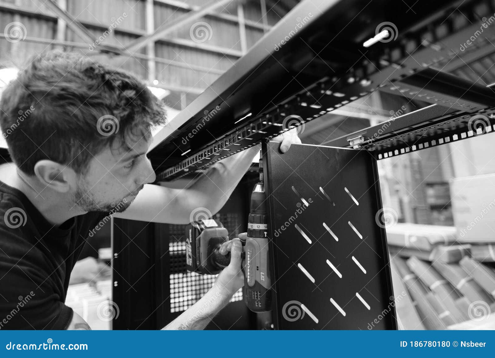Production Line Worker Seen Assembling Data Cabinets at a Factory ...