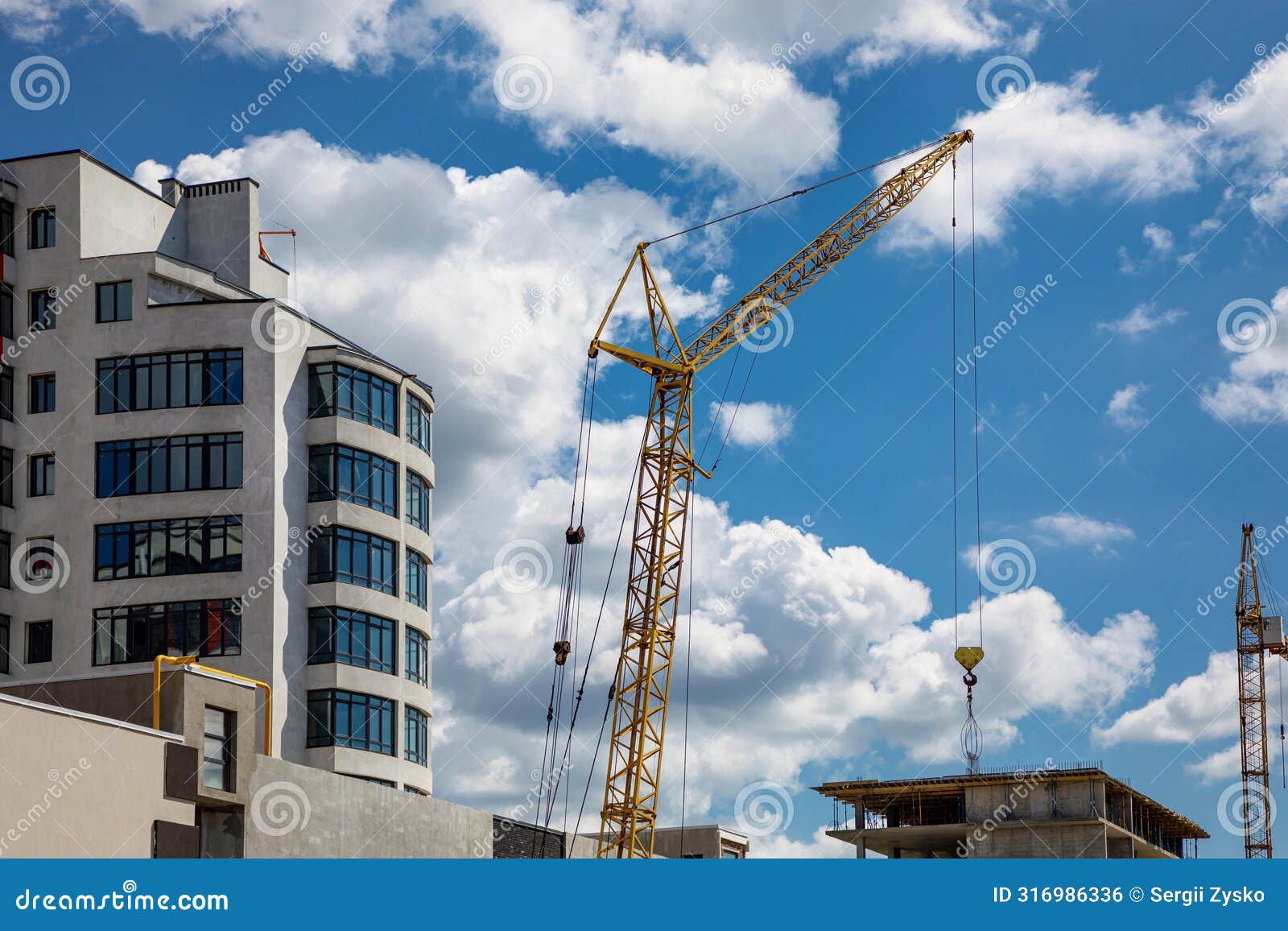 Production Process in the Construction of a New House. Lifting Crane at ...