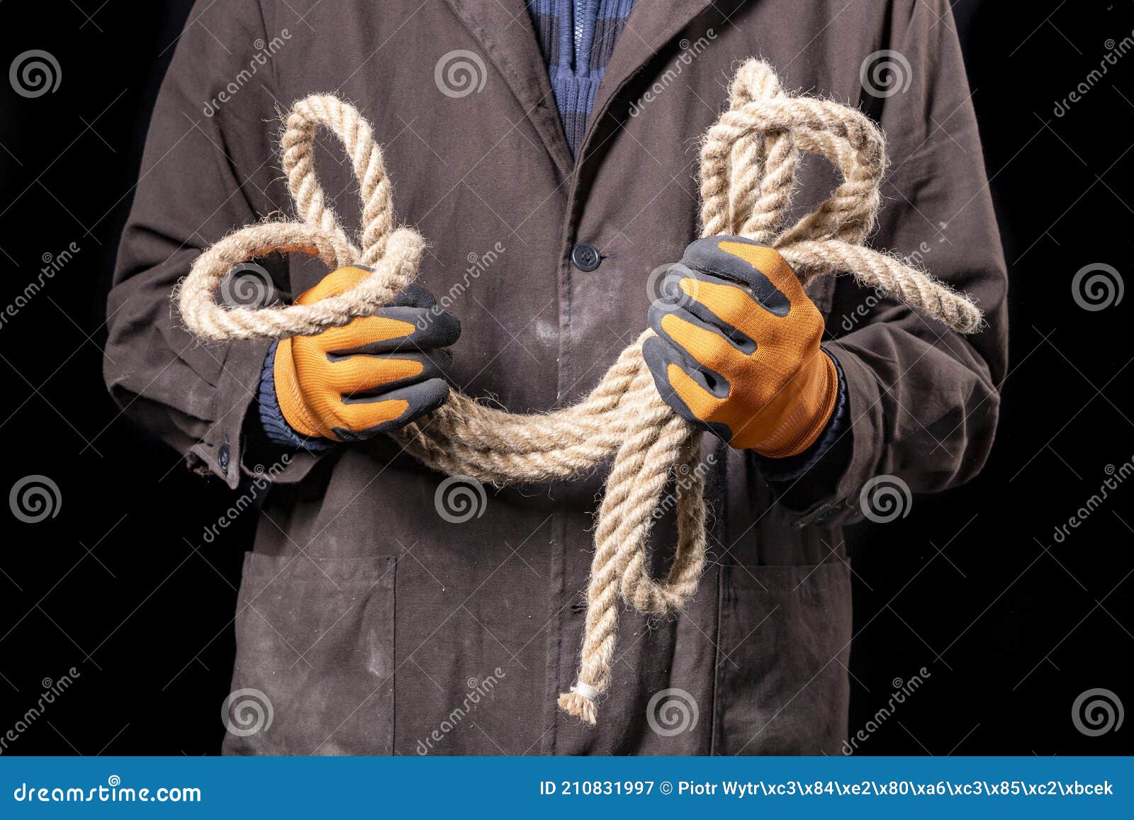 A Production Worker Holding a Thick Rope in His Hands. Construction ...