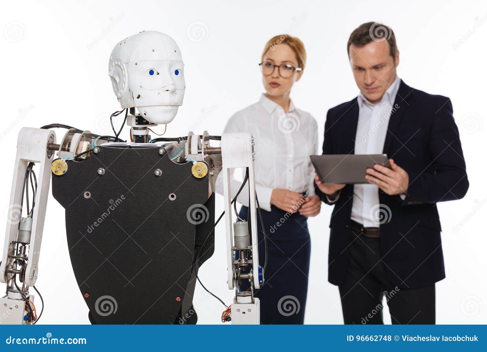 Productive Serious Scientists Studying Robots Abilities Stock Photo ...