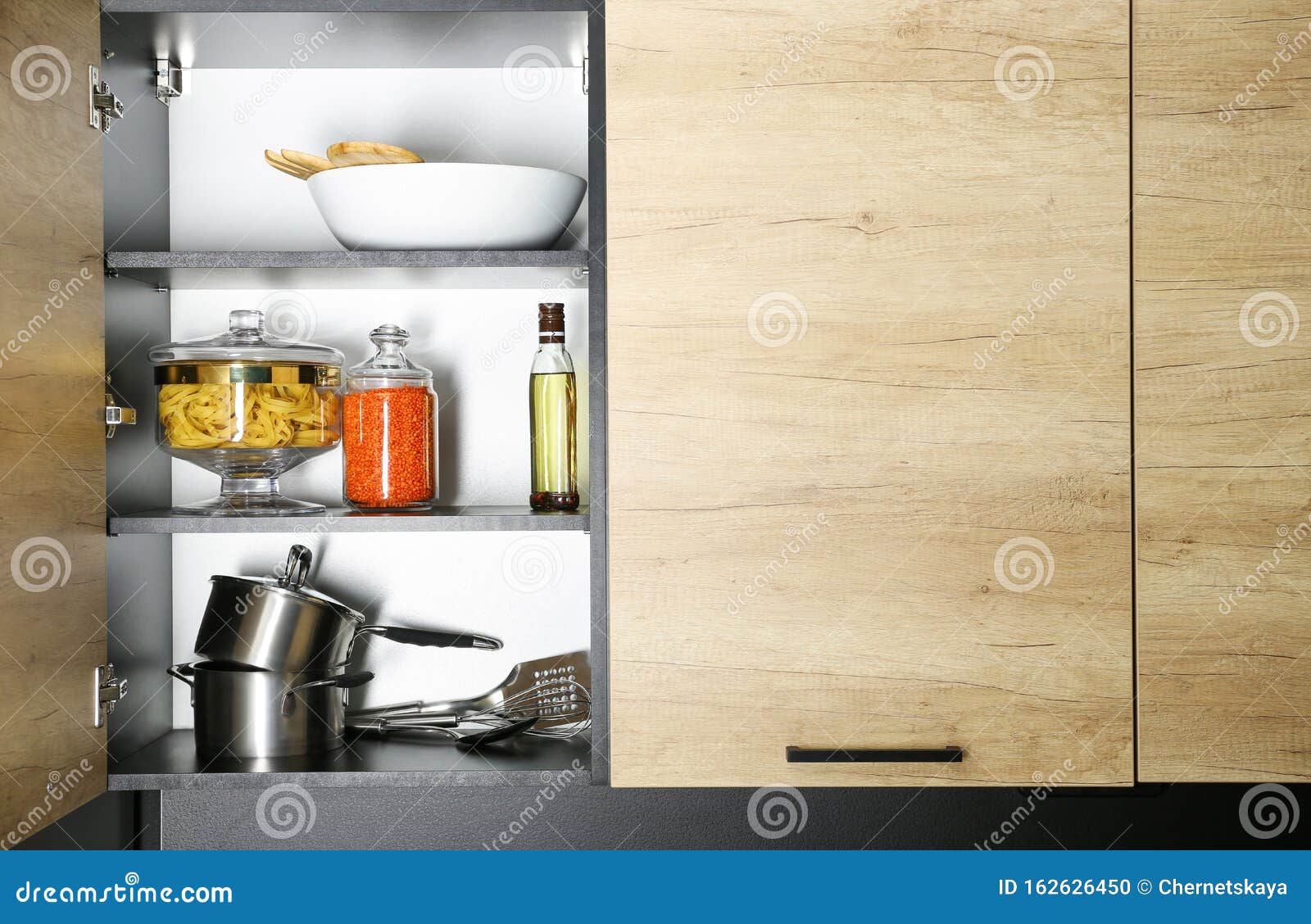 Products and Kitchen Utensils on Shelving Unit Stock Photo - Image of ...