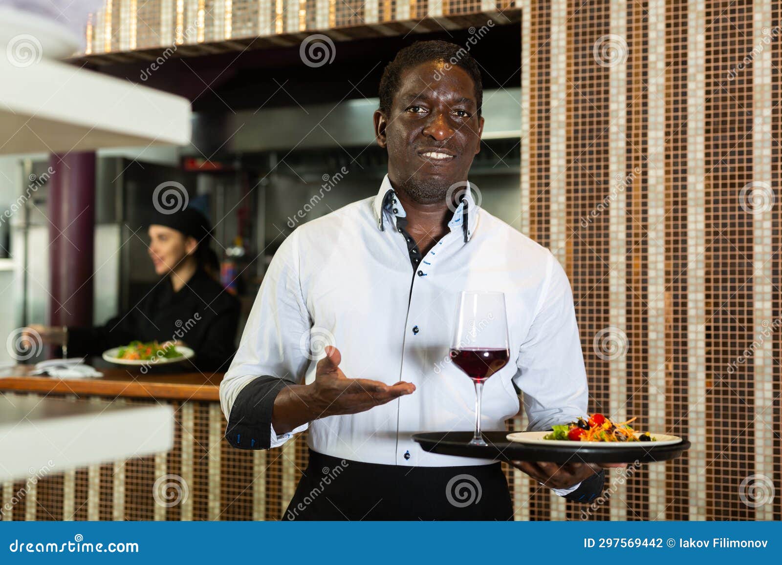 Professional African American Waiter Holding Serving Tray For