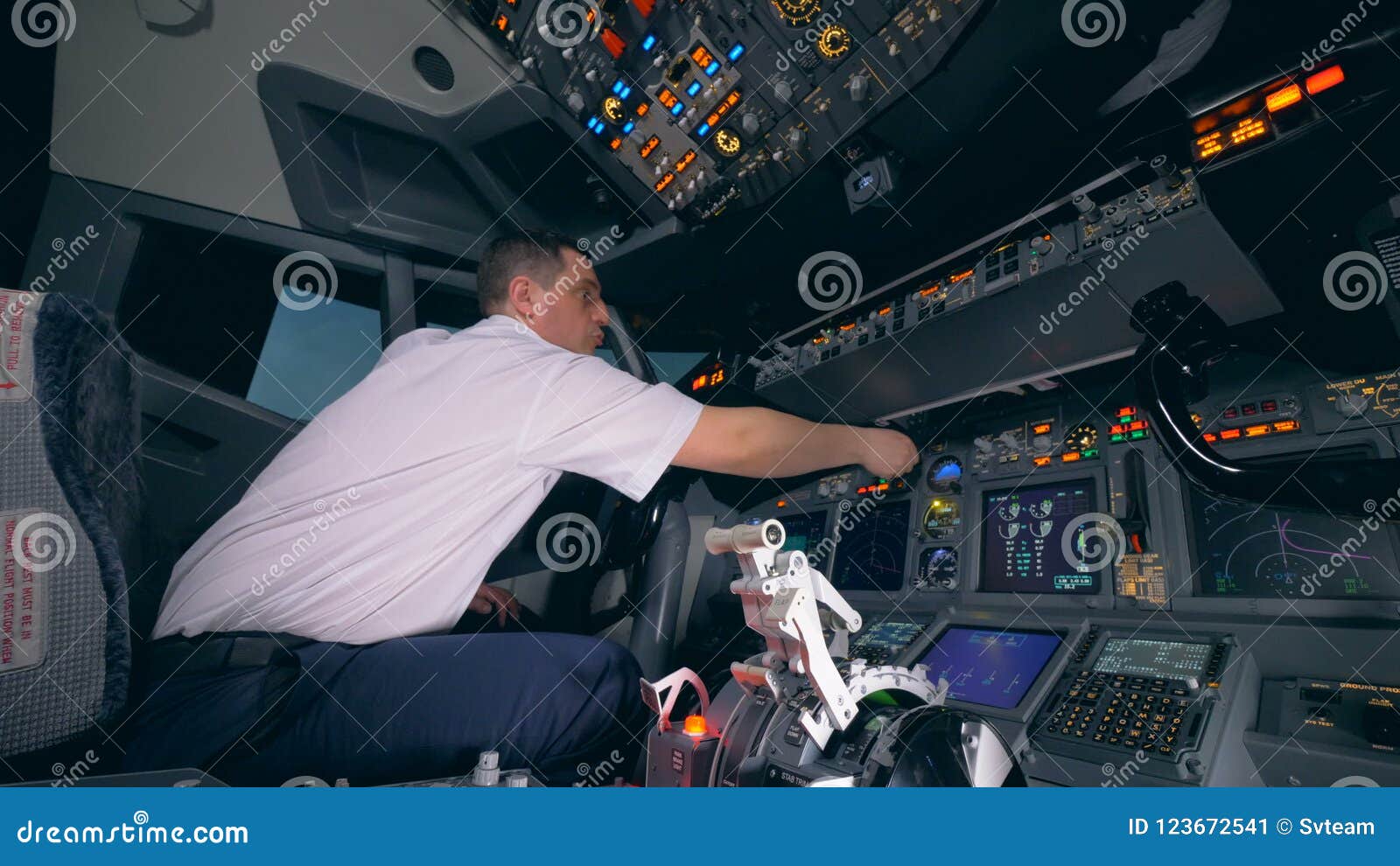 Professional Aiplane Pilot is Turning Indicators on a Cockpit Cabin ...