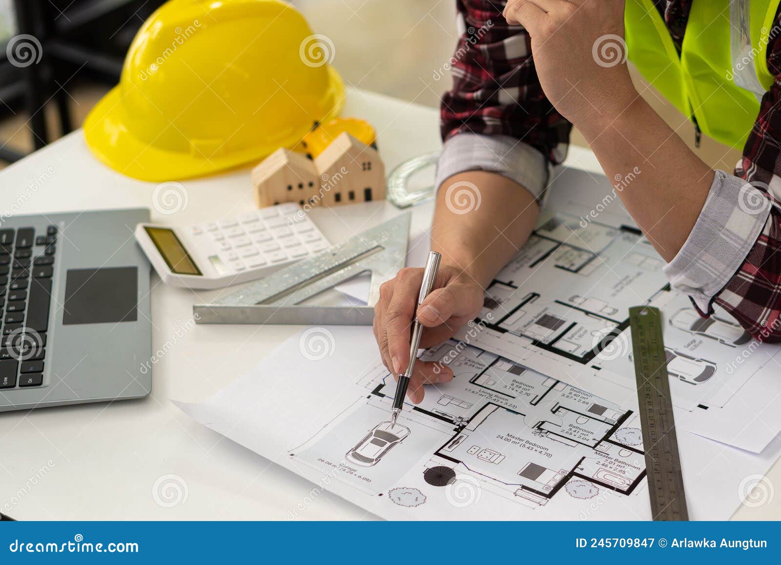 Professional Architect Working on Blueprints and Construction Plans ...